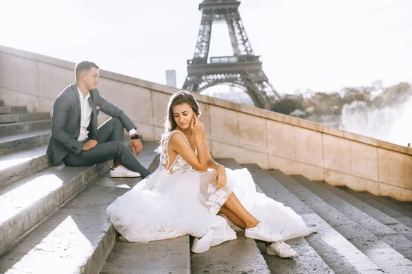 Happy romantic married couple hugging near the Eiffel tower in P ...