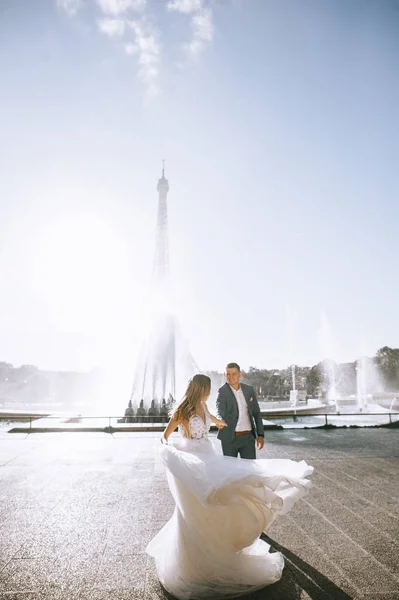 Happy romantic married couple hugging near the Eiffel tower in P ...