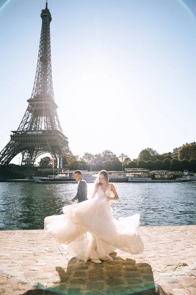 Happy romantic married couple hugging near the Eiffel tower in P ...