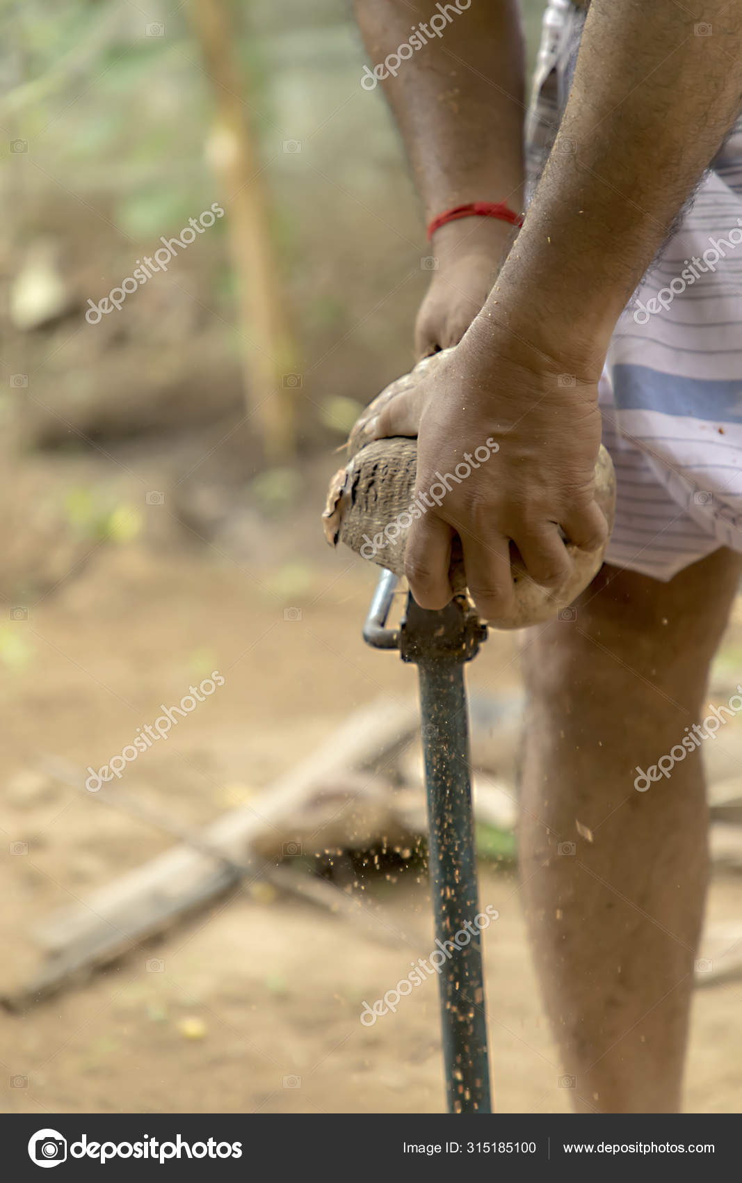 Man open coconut shell by old knife Stock Photo by ©avpk 315185100