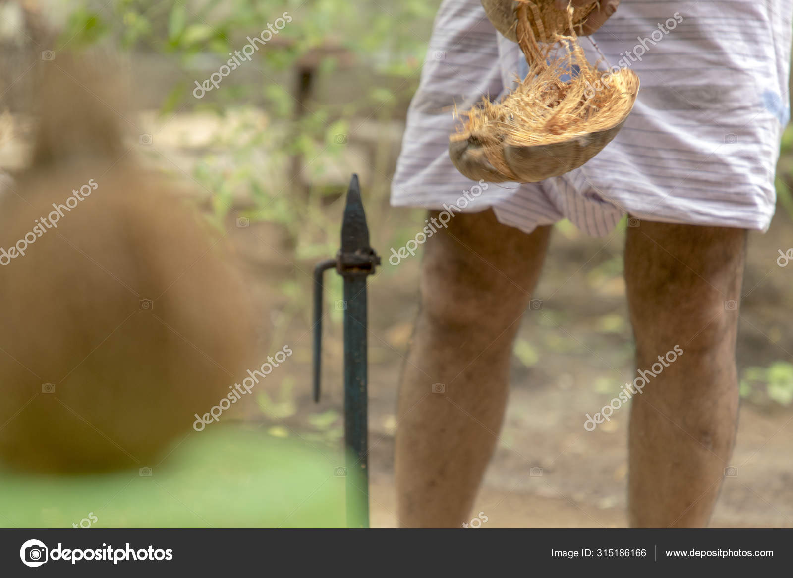 Man open coconut shell by old knife — Stock Photo © avpk #315186166