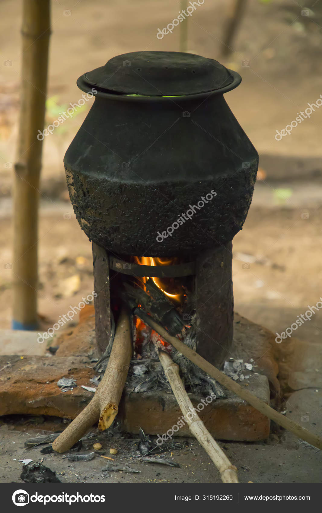Boiling water on an open fire with Wood burning Cook Stove or The Rural ...