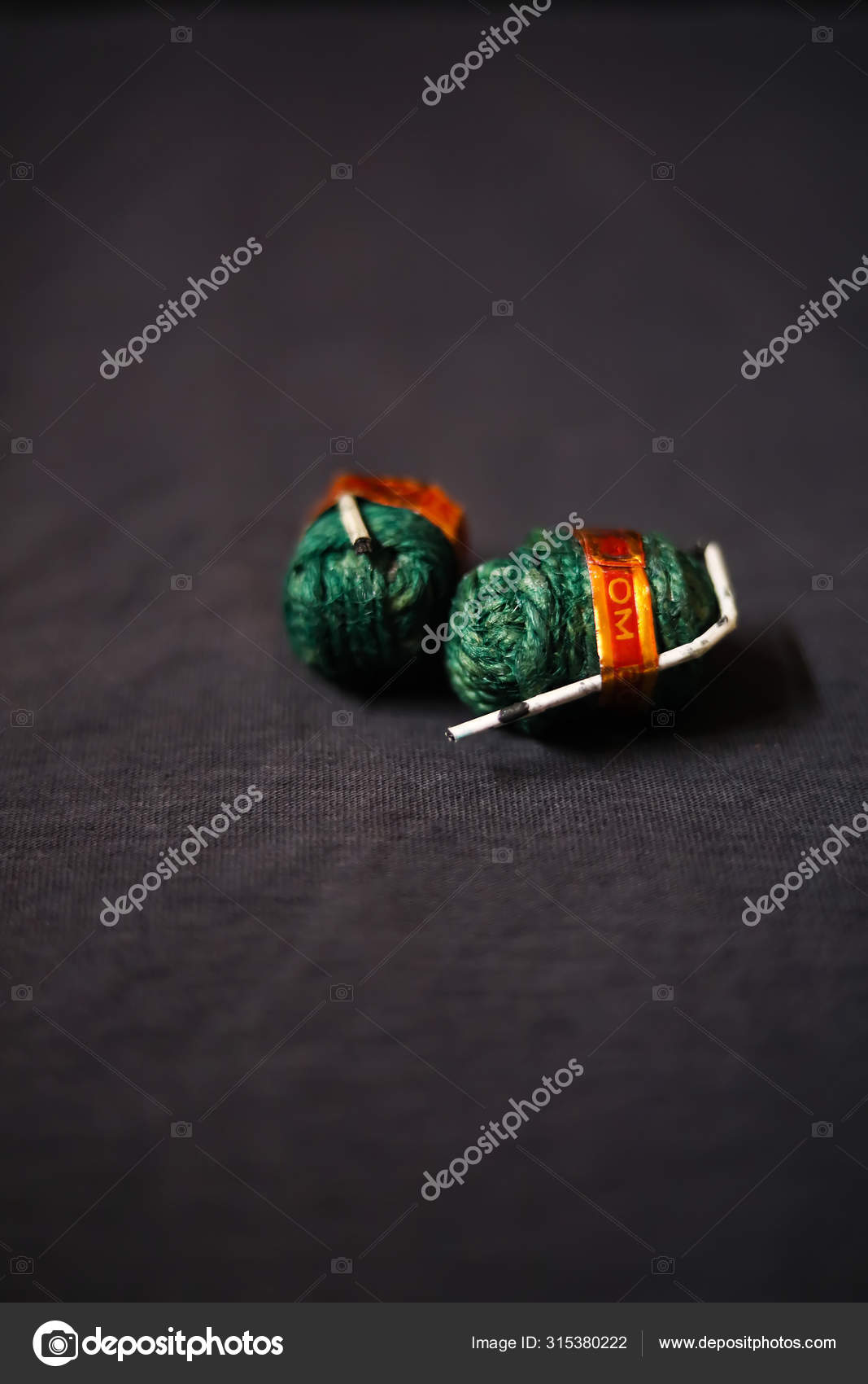 Diwali fire bomb cracker on black background Stock Photo by ©avpk 315380222