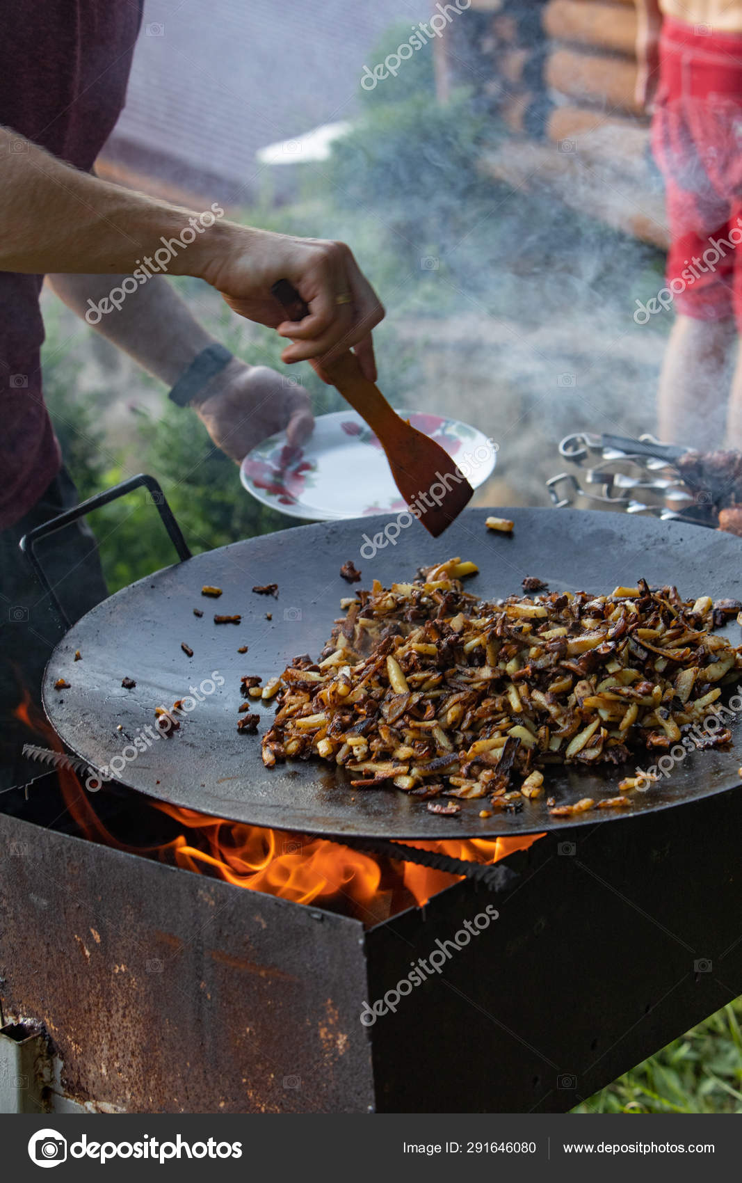 Cooking meat at bbq fire Stock Photo by ©Vera_Petrunina 291646080
