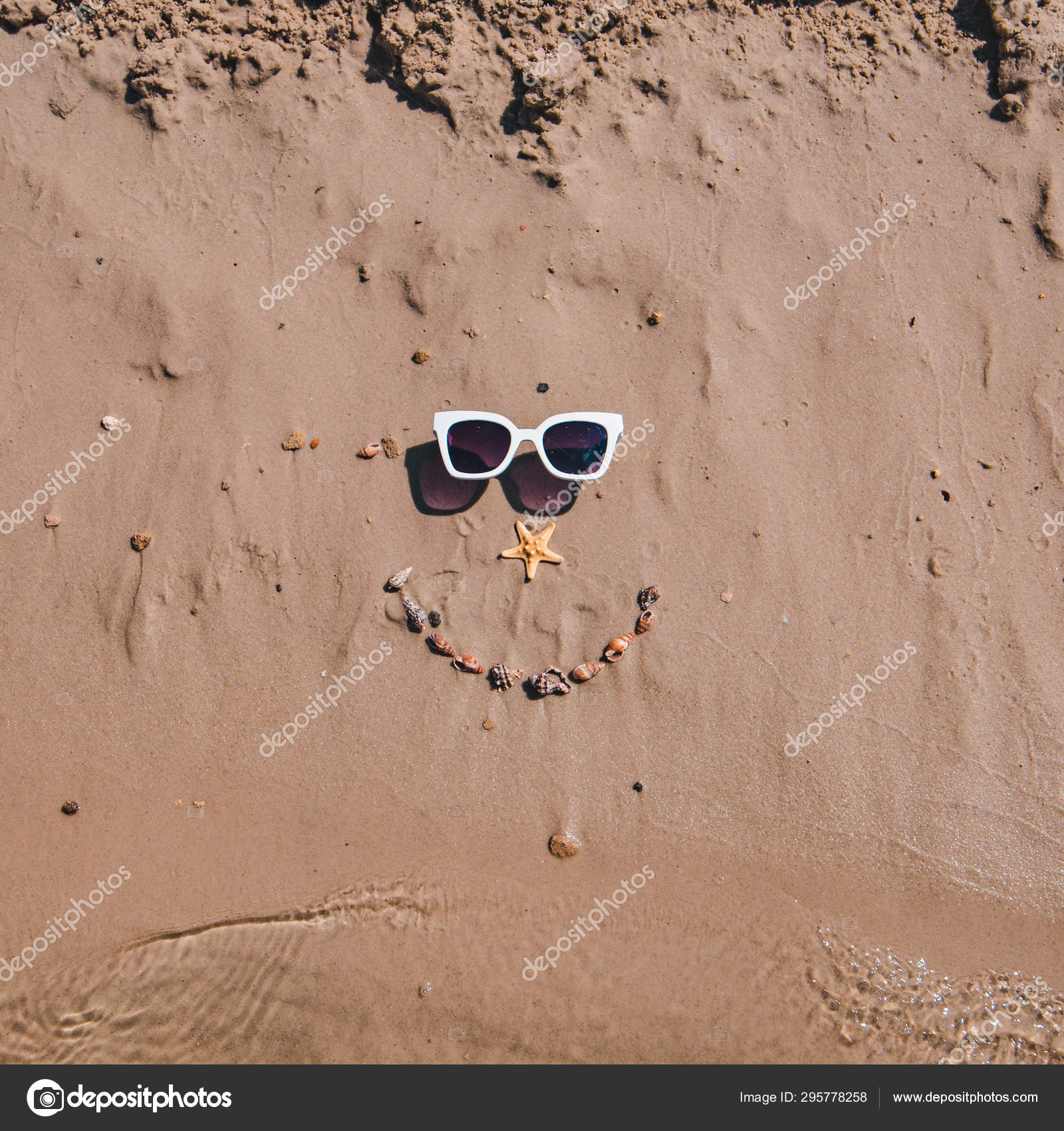 Smile face drawn on sand with shells and sunglasses Stock Photo by ...