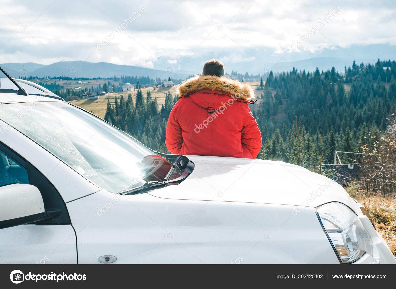 Man lean on the car looking at beautiful view of mountains. off road ...