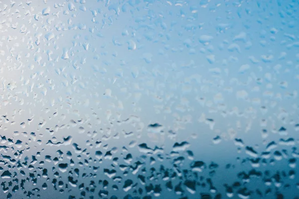 Strong humidity in wintertime. Water drops from home condensation on a ...