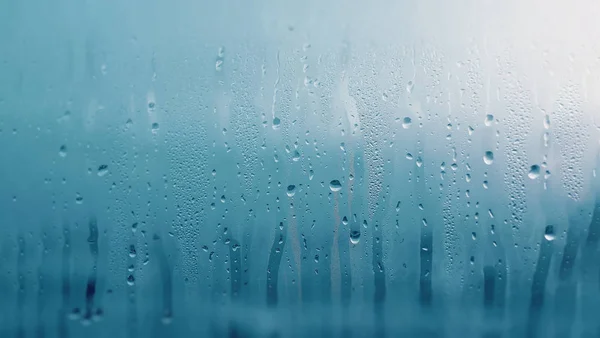 Dripping Condensation on the clear glass window. Water drops. Ab Stock ...