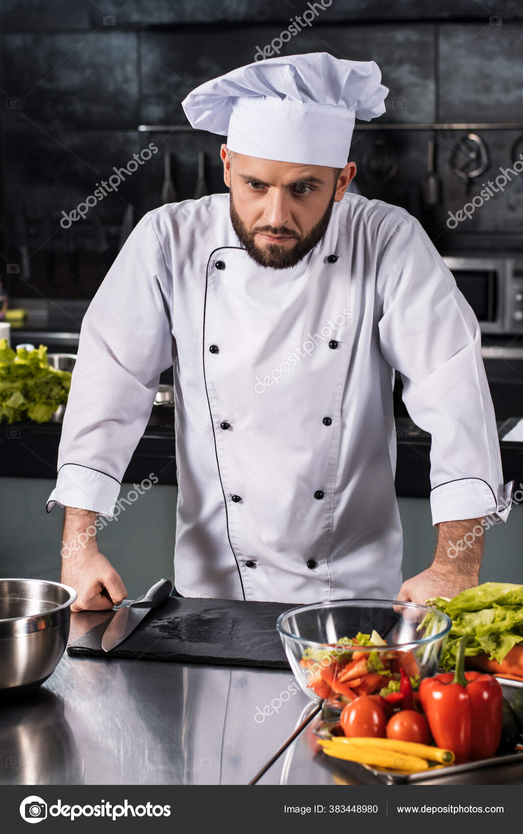 Chef male at kitchen restaurant. Portrait of serious male cooker in ...