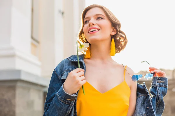 sensual beautiful woman looking forward, wearing stylish jeans jacket ...