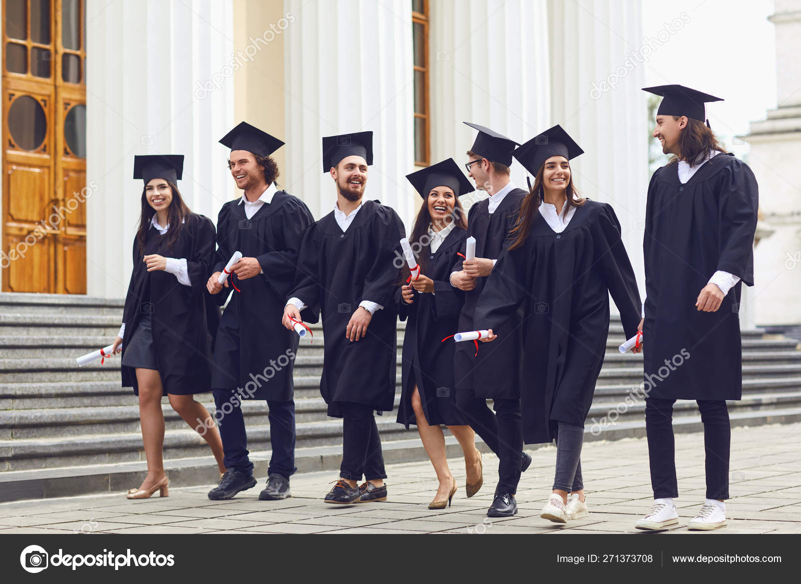 Group of students graduates go against the university college. — Stock ...