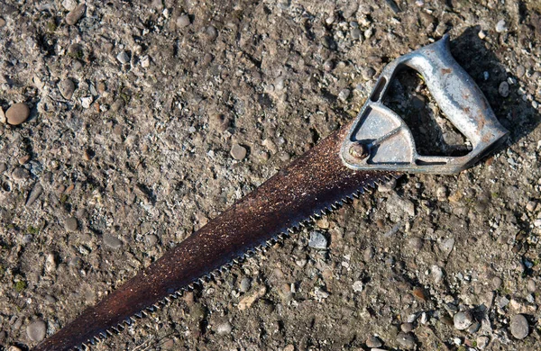 old rusty saw on the ground, metal saw - Stock Image - Everypixel