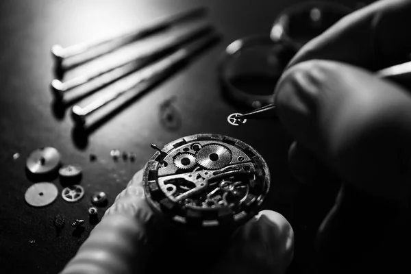 Watch maker is repairing a vintage automatic watch. - Stock Image ...