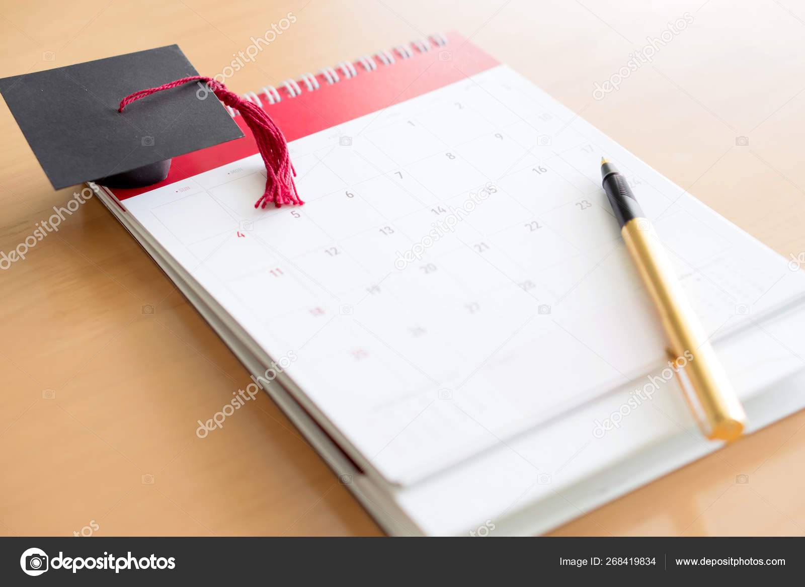 Pen on calendar and Graduation cap — Stock Photo © Ekachailo #268419834