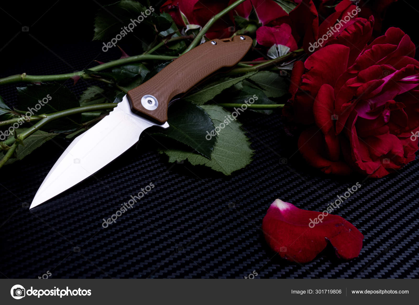 Elegant beautiful knife and a bouquet of roses. — Stock Photo © vzwer ...