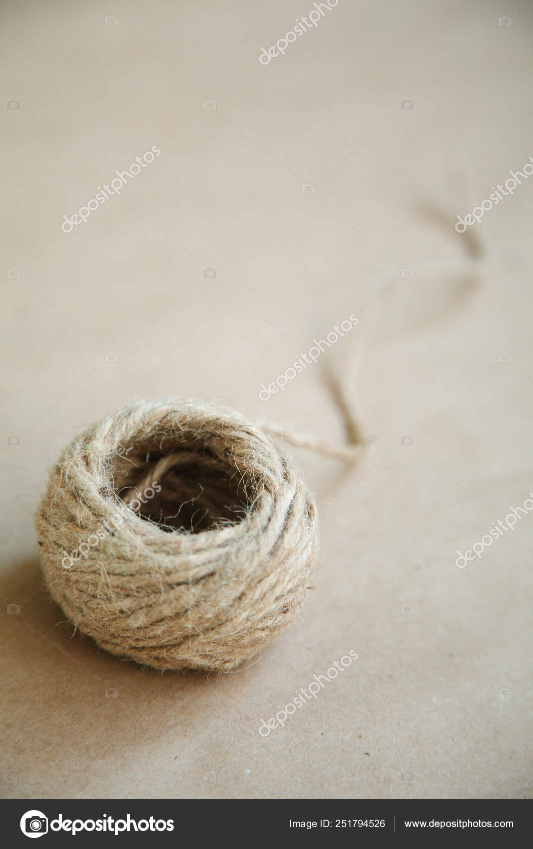 Thread clew on paper background Stock Photo by ©LIIMIT 251794526