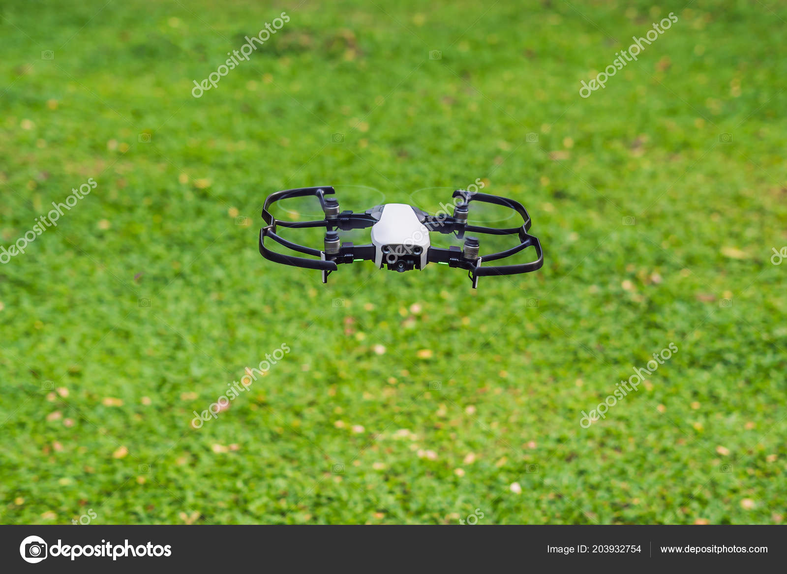 White Drone Flying Grass Background Stock Photo by ©galitskaya 203932754