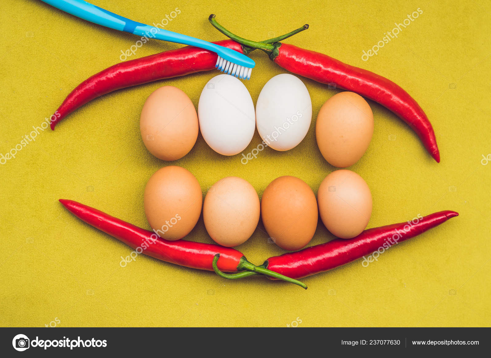 Eggs and red pepper in the form of a mouth with teeth. White eggs are ...