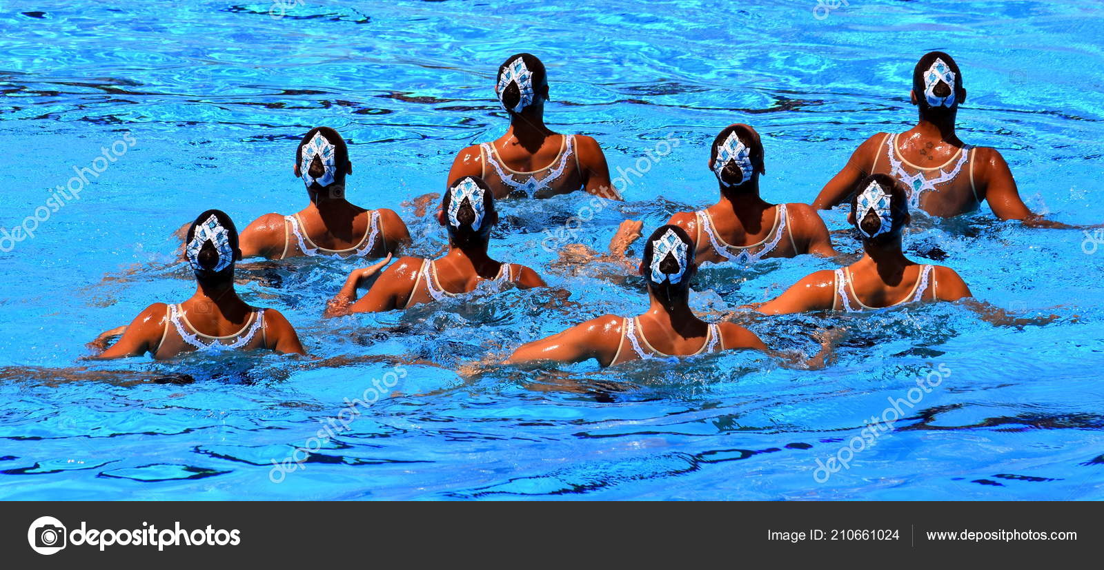 Synchronized Swimming Team Performing Synchronized Routine Elaborate ...