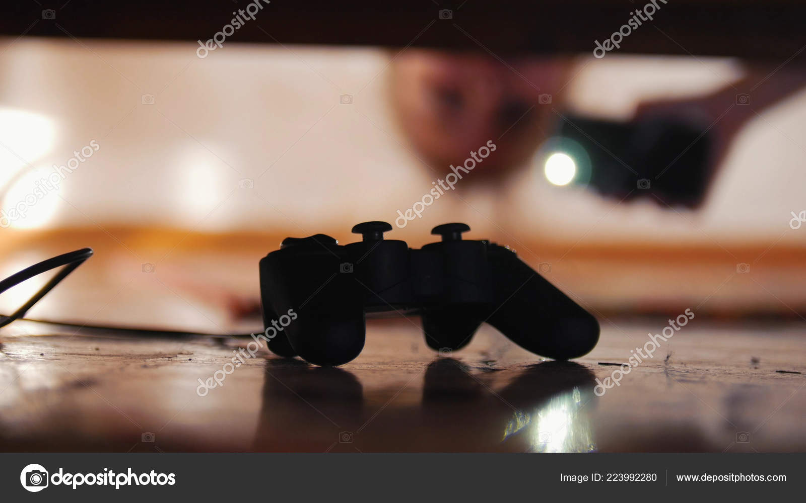 Black joystick under the bed. Girl looking under the bed — Stock Photo ...