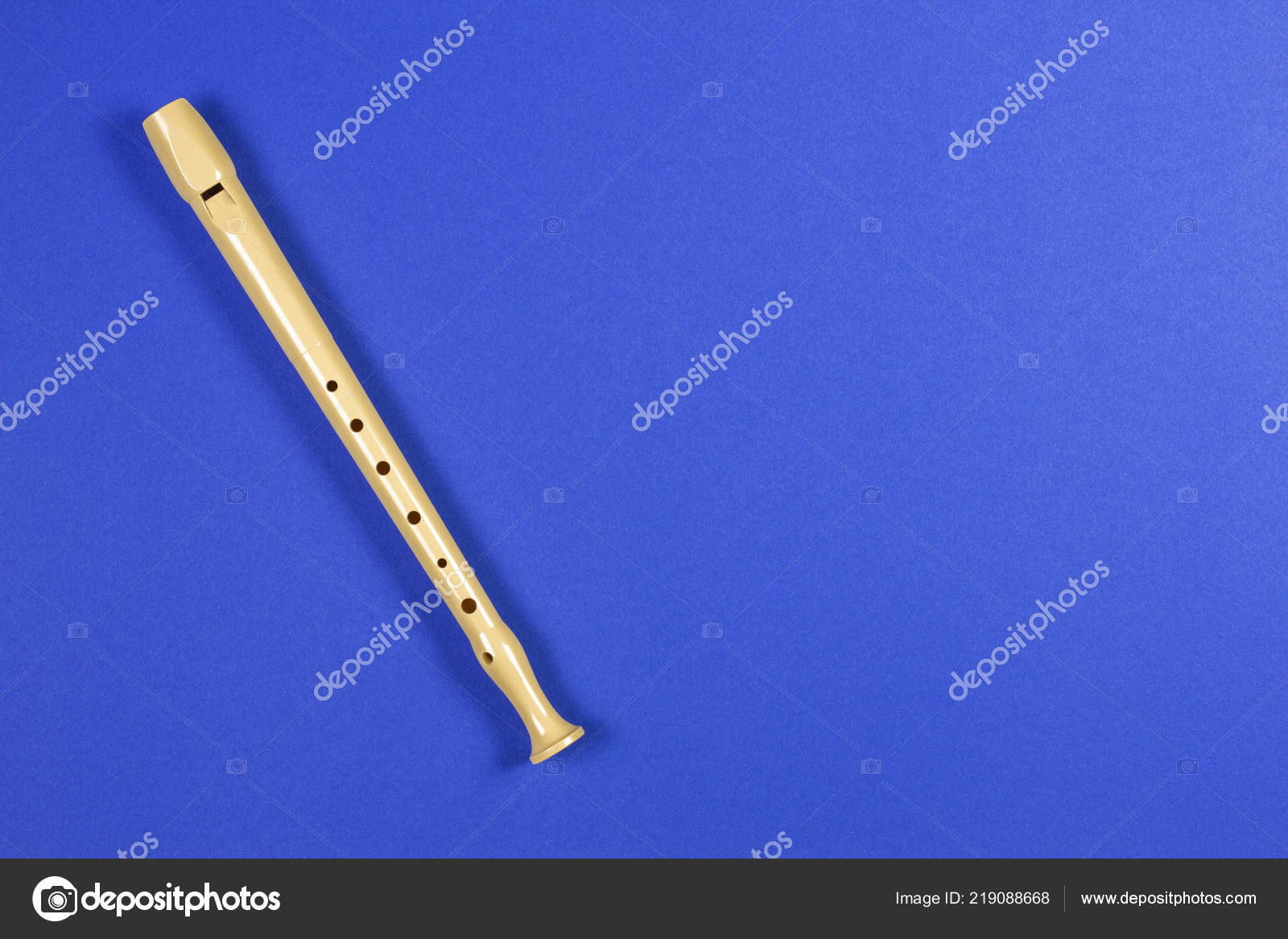 Musical instrument flute on blue color background. — Stock Photo ...
