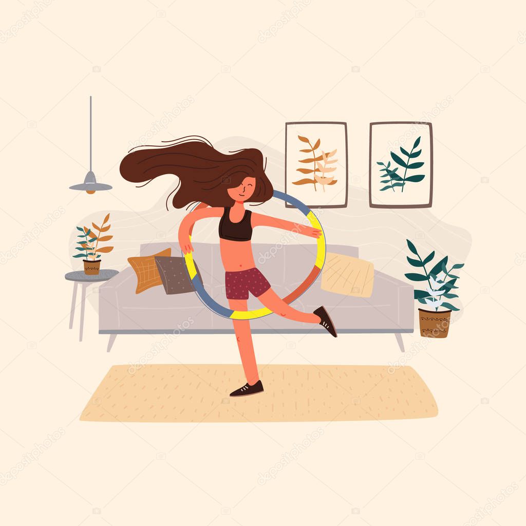 La chica está haciendo girar un aro en la habitación. 2023