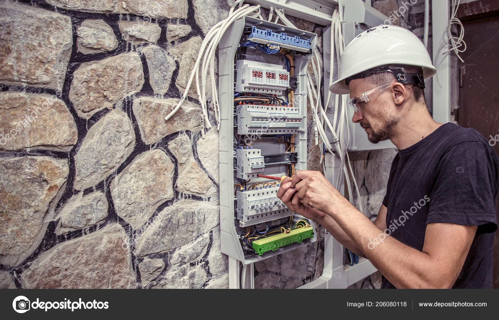 Male Electrician Works Switchboard Electrical Connecting Cable Connects ...