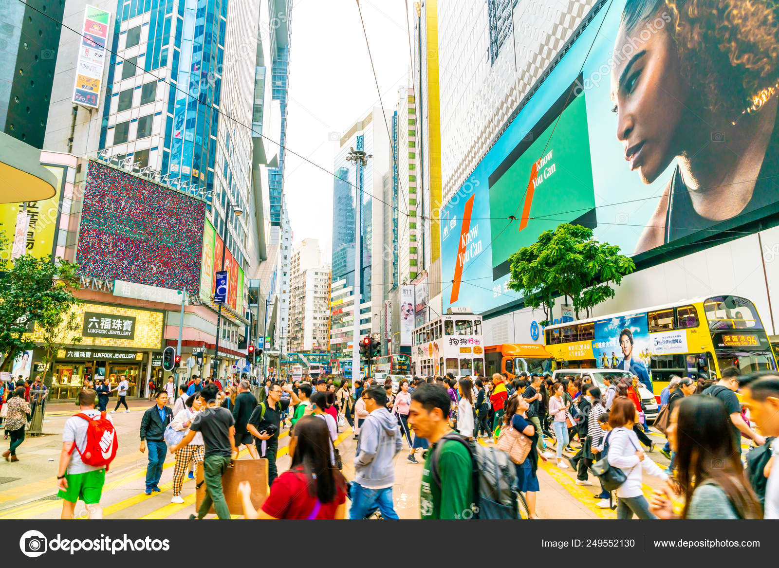 HONG KONG - FEB 21 2019: People walking across Hennessy Road, Ca ... HONG KONG - FEB 21 2019: People walking across Hennessy Road, Ca ...