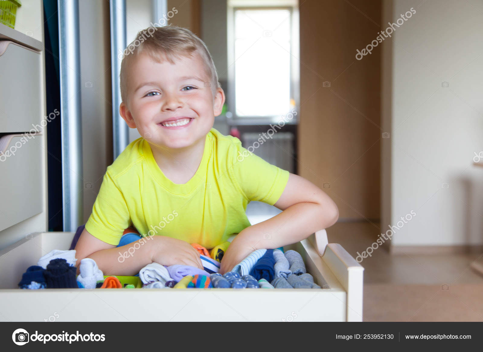 Child Puts His Clothes Boy Pulls Shirt Out Closet Stock Photo by ...