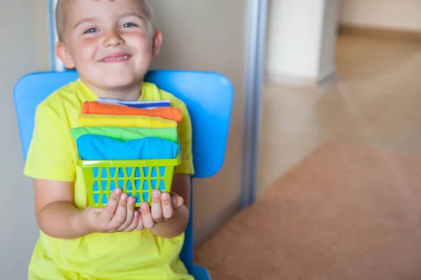 Child Puts His Clothes Boy Pulls Shirt Out Closet Stock Photo by ...