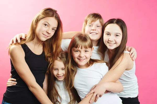Group Cute Girls Hugging While Posing Pink Background Stock Photo by ...