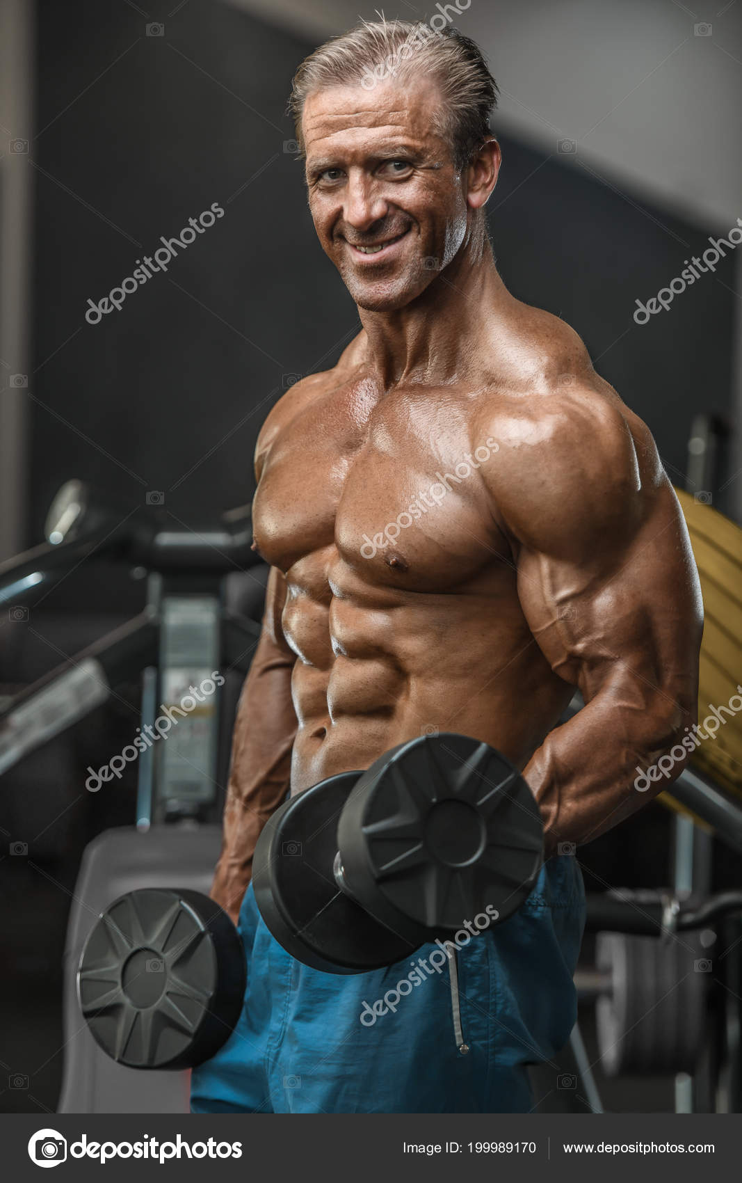 Brutal Strong Bodybuilder Athletic Aged Man Pumping Muscles Workout ...