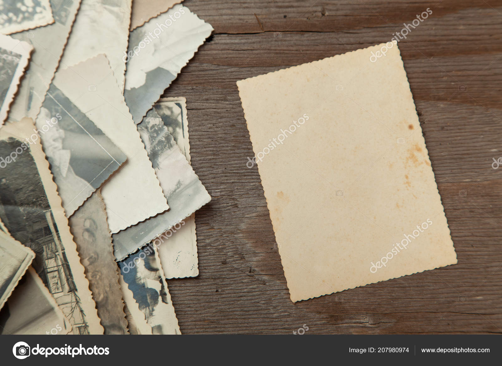 Stack old photos on table. Mock-up blank paper. Postcard rumpled and ...