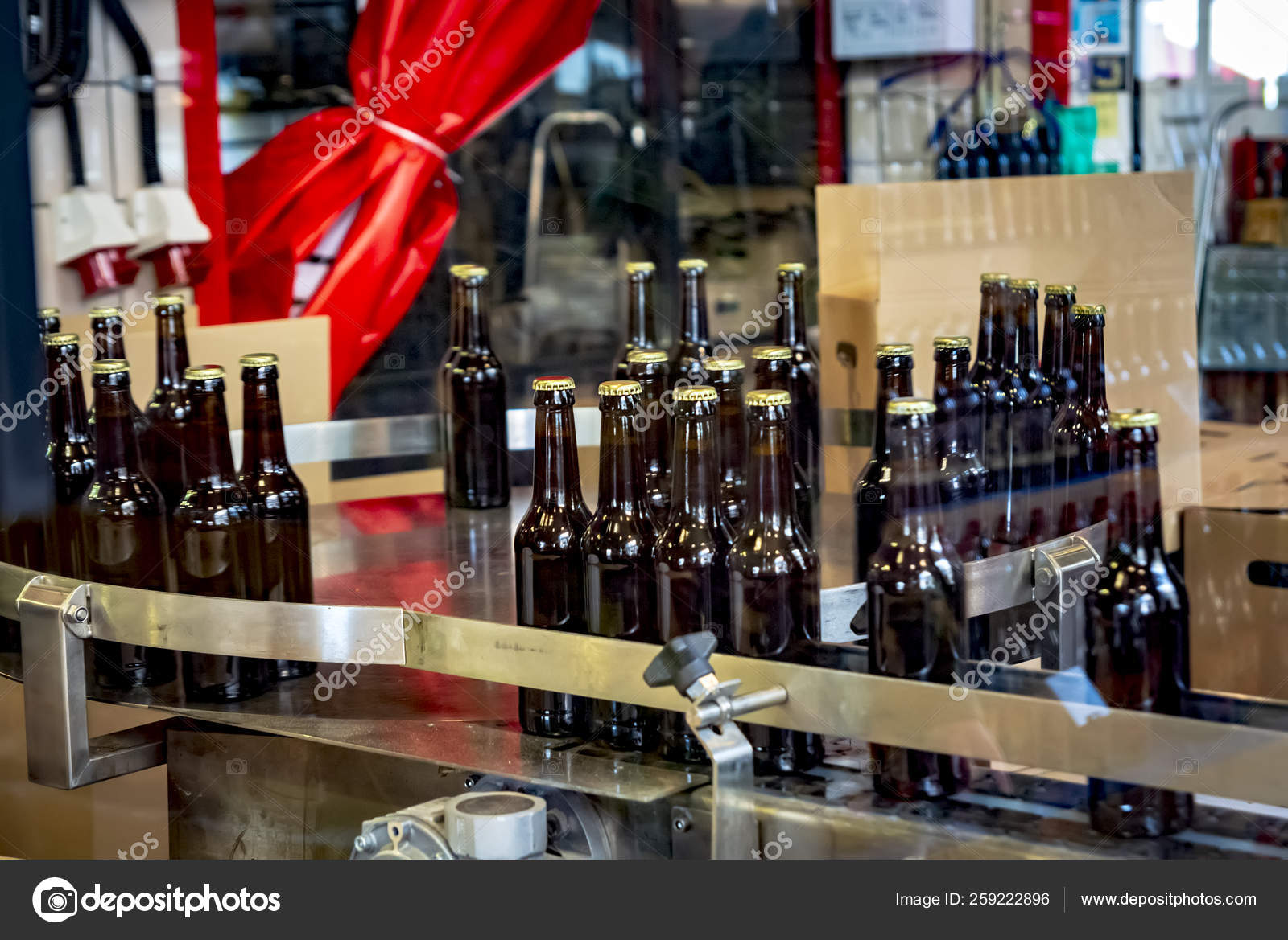 Full beer glass bottles moving on a conveyor line Stock Photo by ...
