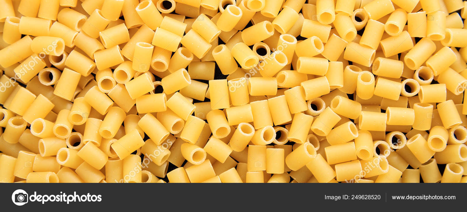 Uncooked macaroni cut pasta texture background, banner Stock Photo by ...