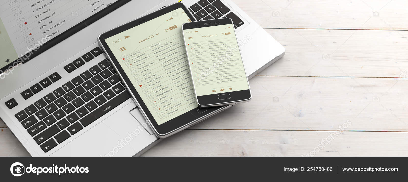 Email lists on smartphone and tablet screens, computer keyboard and ...