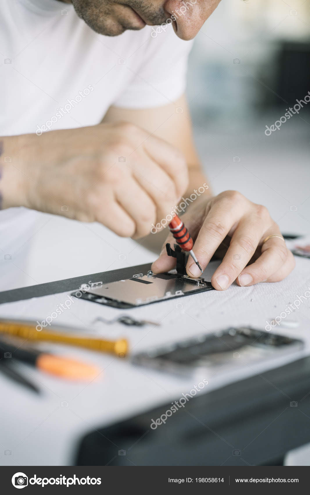 Electronics Repair Service Technician Disassembling Smartphone ...