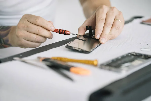 Electronics Repair Service Technician Disassembling Smartphone ...