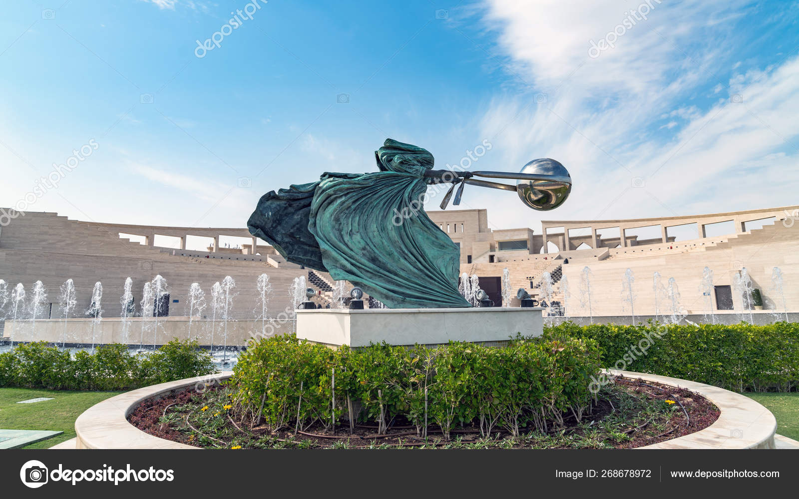 Katara Cultural village with statue in foreground and the Amphitheater ...