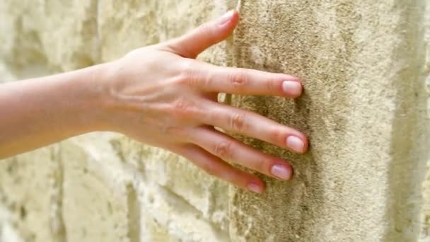 Woman Sliding Hand Against Old Stone Wall In Slow Motion Female Hand
