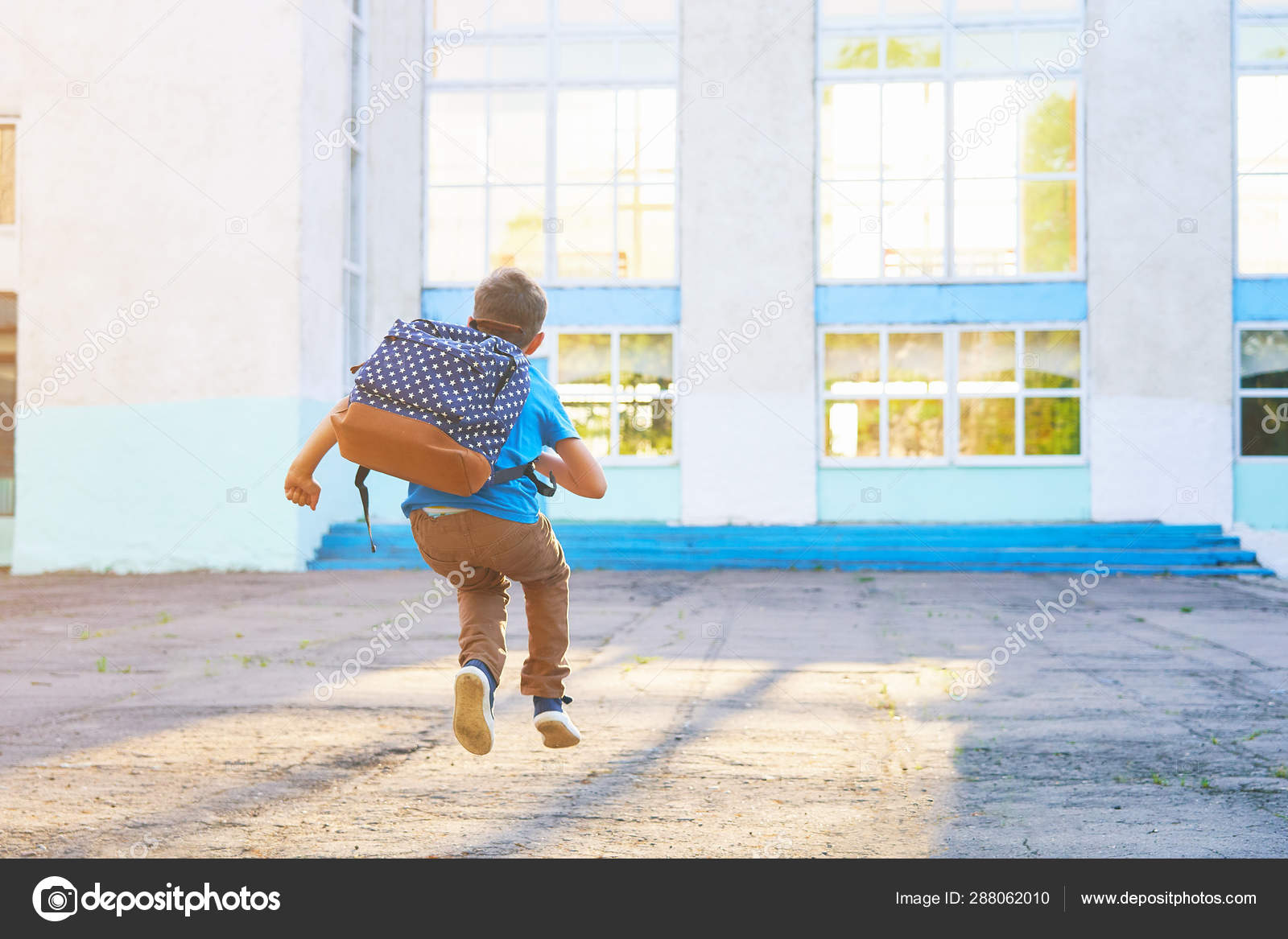 Happy little boy, high jumped with joy, the beginning of the sch ...