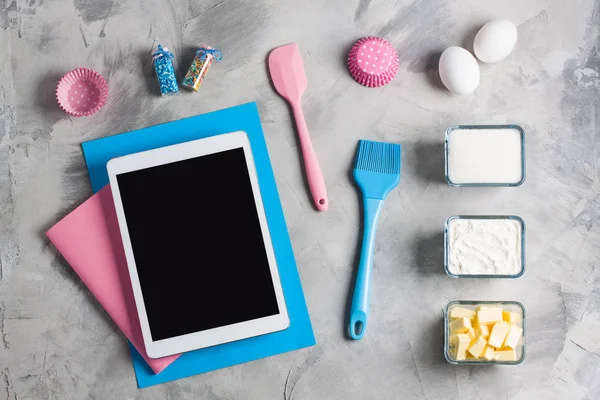 Tablet mobile application service website mockup kitchen baking with eggs butter flour sugar ...