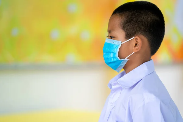 Asia student wear protective face masks for safety in elementary school ...