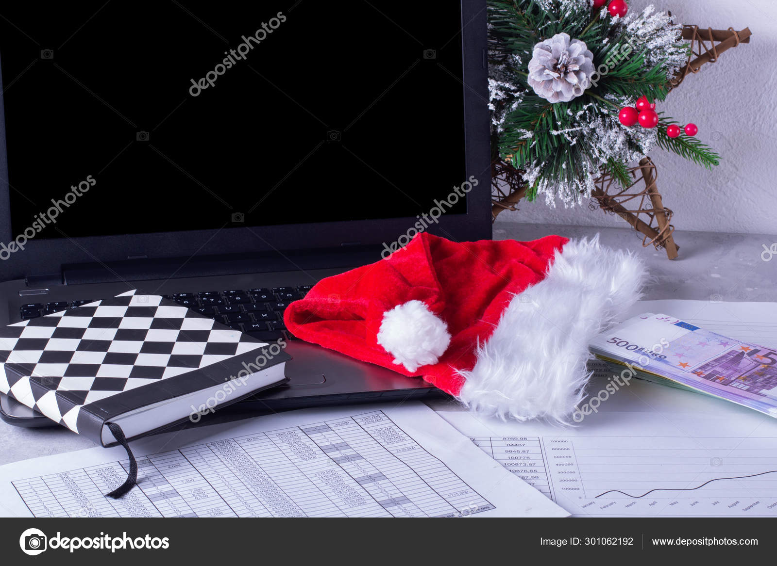 Desktop with laptop and charts. Santa hat Stock Photo by ©wings2016 ...