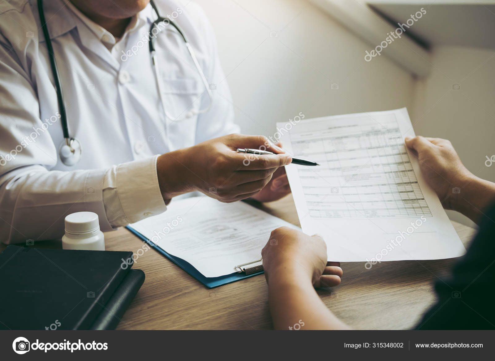 Doctor is explaining the treatment about the possible treatment Stock ...