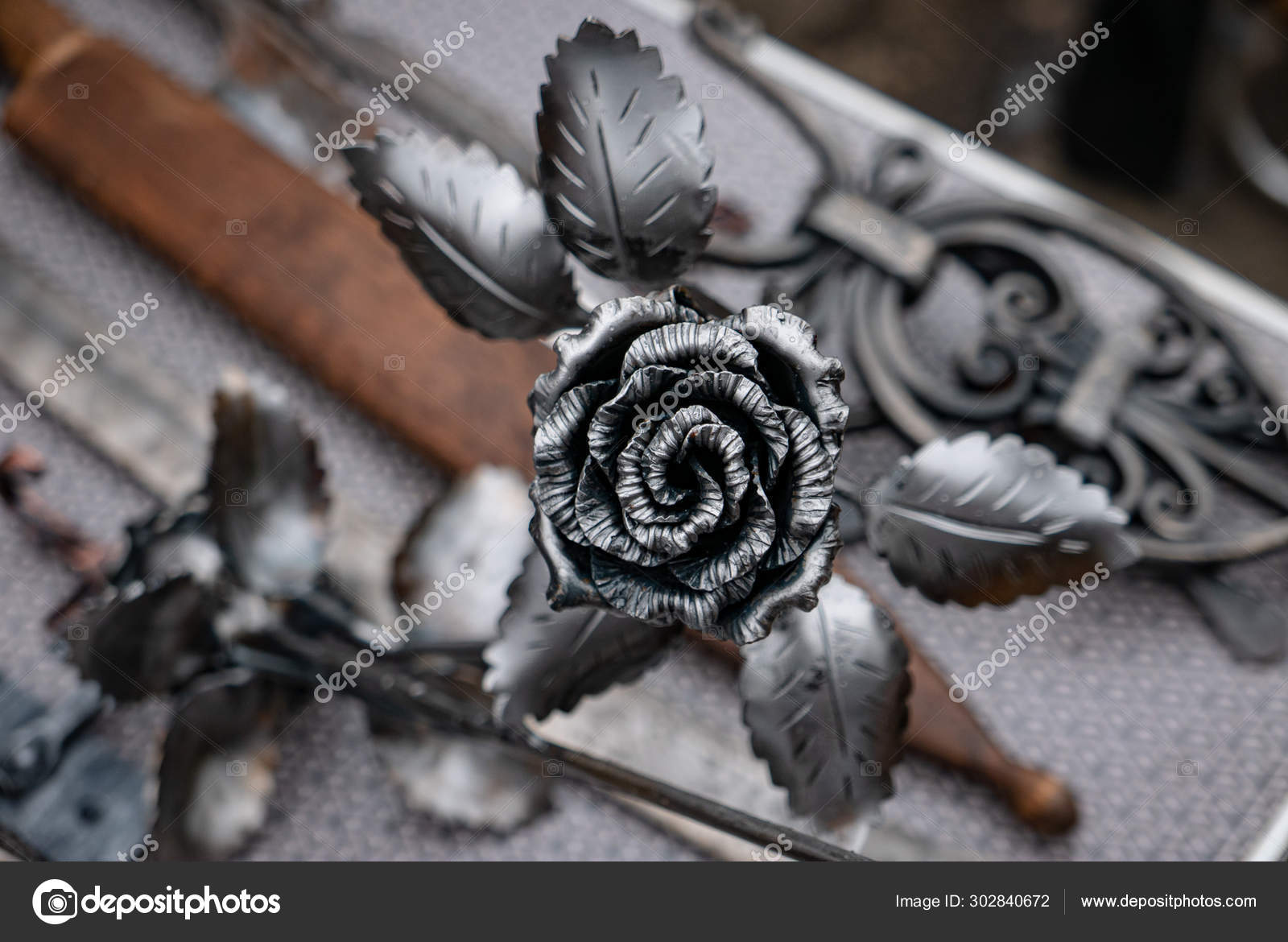 Metal rose made by a blacksmith over gray background Stock Photo by ...