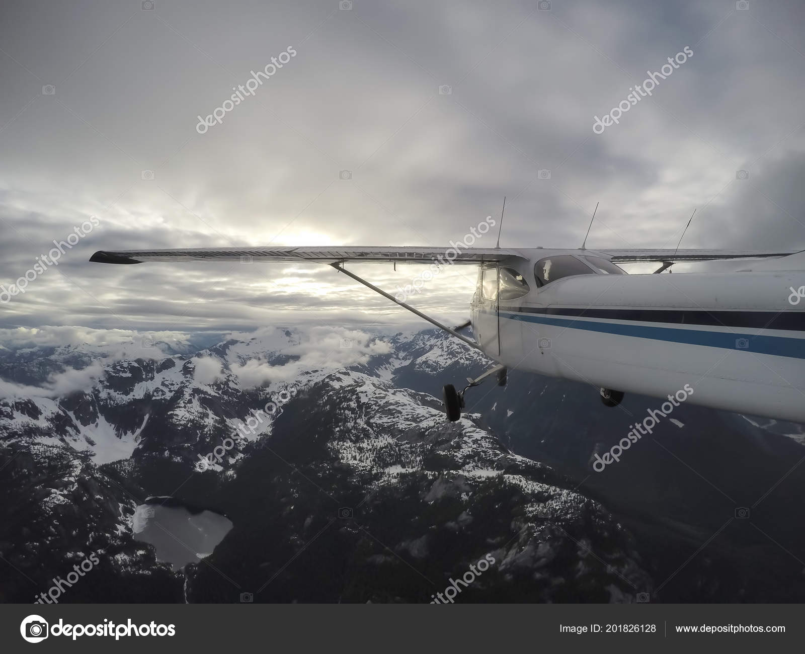 Airplane Flying Beautiful Canadian Mountain Landscape Cloudy Evening ...