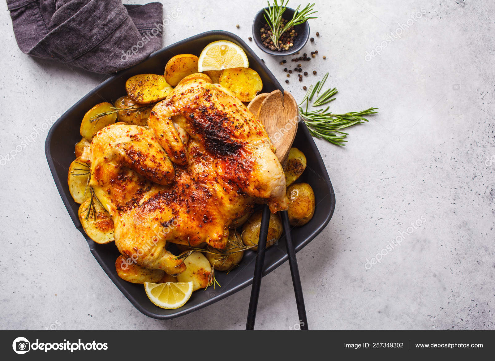 Fried whole tabaka chicken with potatoes in a grill pan, top vie Stock ...
