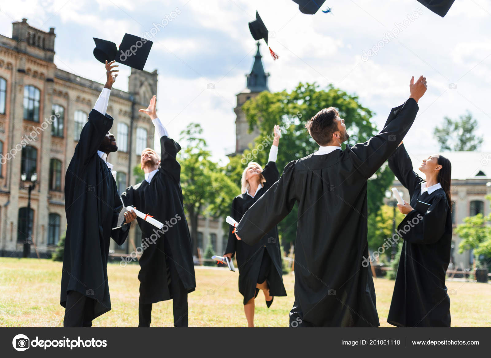 Young Graduated Students Throwing Graduation Caps University Garden ...