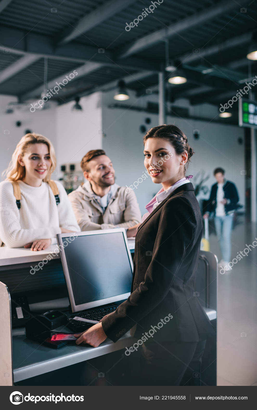 Young Airport Worker Checking Documents Smiling Camera Check Desk ...